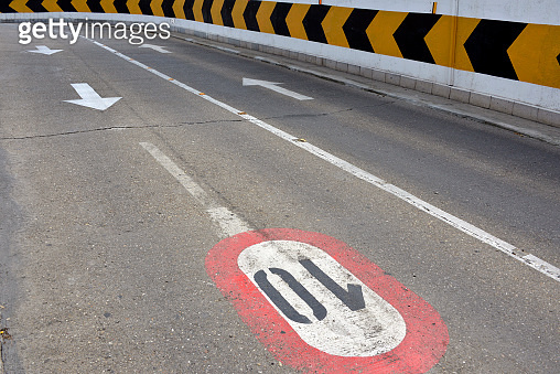 Speed limit sign on the road, at the entrance to the underground garage ...