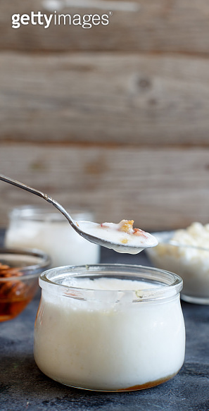 Fermented yogurt kefir in small bottles with cherries and walnuts 이미지 ...