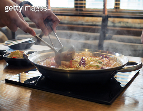 Metal hot pot of chicken (Jim dak or Jjim Dak) with cutted chicken ...