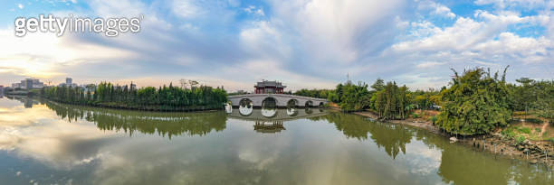 Chinese traditional arch bridge in Huayang Lake Wetland Park, Dongguan ...