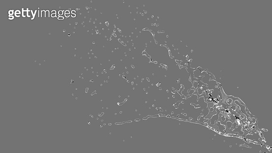 Large amount of water splashing and pouring from corner with bubbles ...