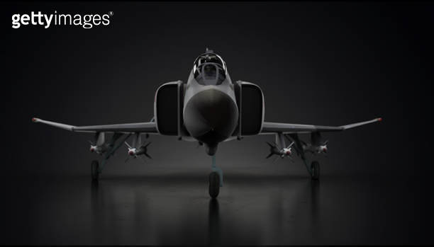 F-4 aircraft fighter jet in undisclosed location in hangar facing front ...
