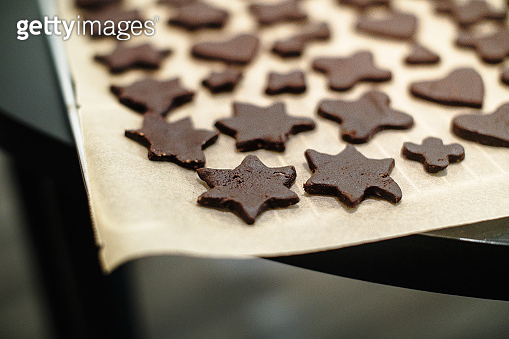 Christmas chocolate biscuits/cookies ready to be cooked in the oven ...