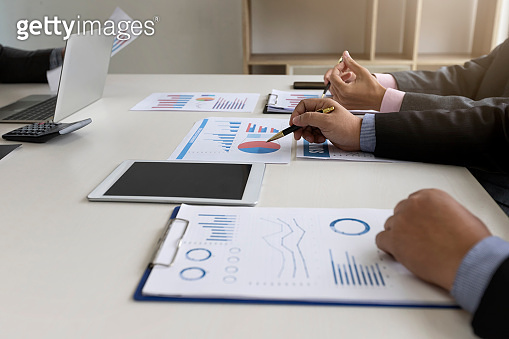 Businessmen discussing together in meeting room. Business team meeting ...