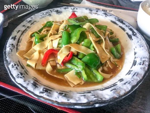 Chinese pressed tofu sheet shreds fried with bell peppers served at ...