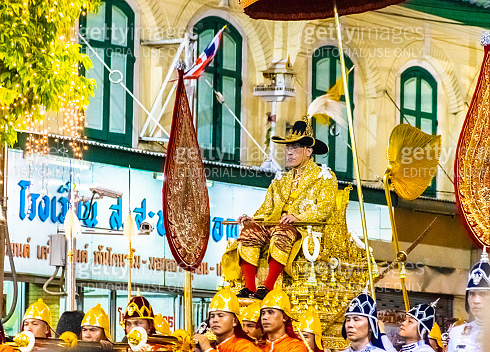 Thailand's King Maha Vajiralongkorn is carried in a golden palanquin ...
