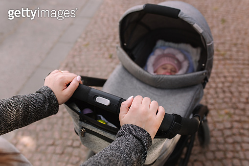 First person view of mother strolling with newborn outside. Mother's ...