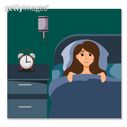 The girl suffers from insomnia, she lies in bed and cannot sleep ...