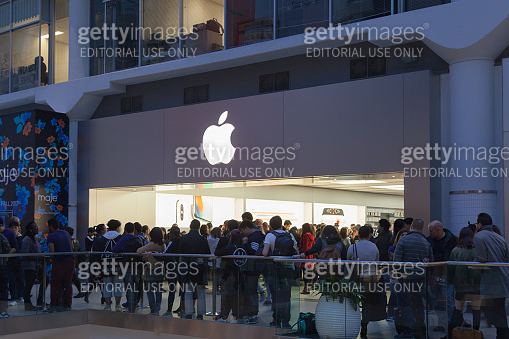 People line up to buy new iPhone X at the Apple store in Eaton Centre ...