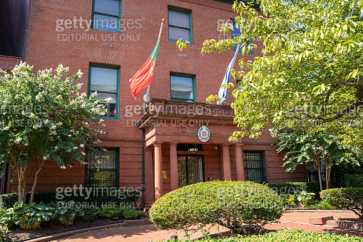 The Embassy of Portugul showing the entrance sign and flags along ...