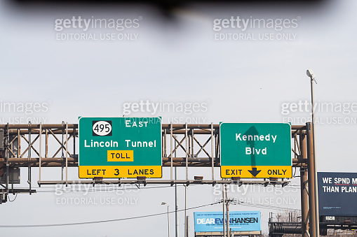 Exit sign in New Jersey for Lincoln Tunnel toll on 495 east and Kennedy ...