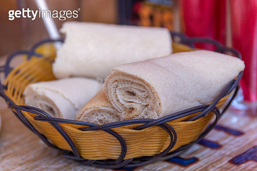 Rolls of Injera in a serving bowl 이미지 (1132051639) - 게티이미지뱅크