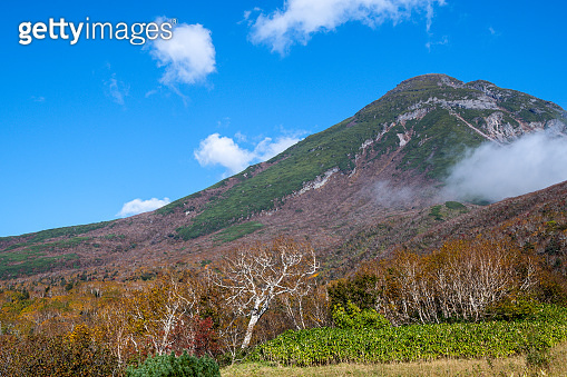 Mount Rausu with autumn leaves as seen from Shiretoko Pass Road ...