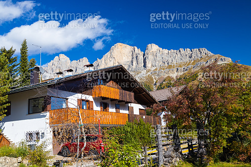 Alpine village of Carezza in the Dolomites with views of Mount Roda di ...