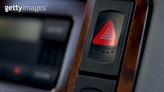 Car hazard warning flasher button on dashboard, emergency situations ...