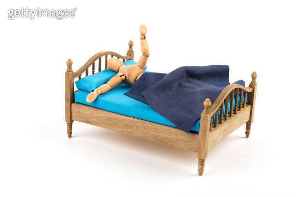 wooden mannequin is lying in bed, can not sleep or wake up (1164306762 ...