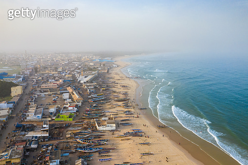 Aerial view of fishing village, pirogues fishing boats in Kayar ...