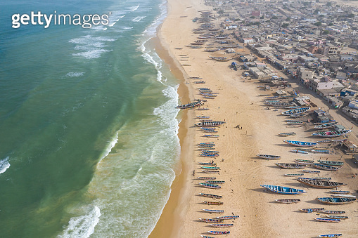 Aerial view of fishing village, pirogues fishing boats in Kayar ...