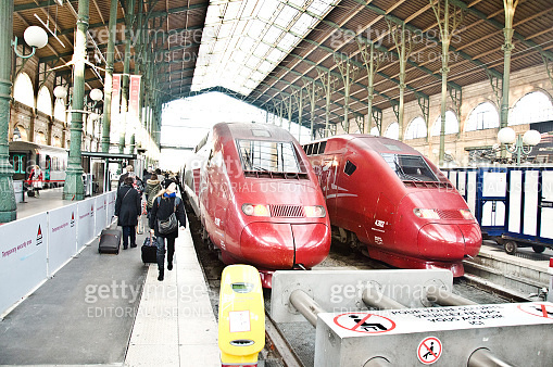 Tourists and travellers walking towards the platform to board a SNCF ...