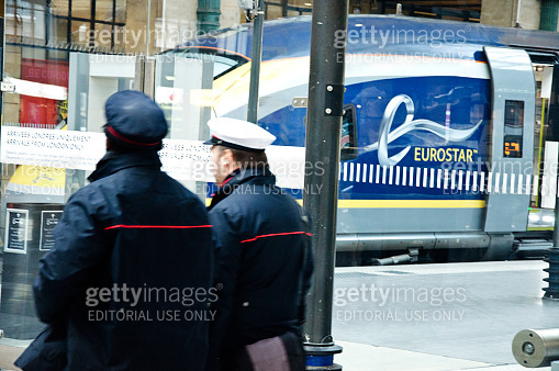 Security officers outside a newly arrived Eurostar high-speed train ...