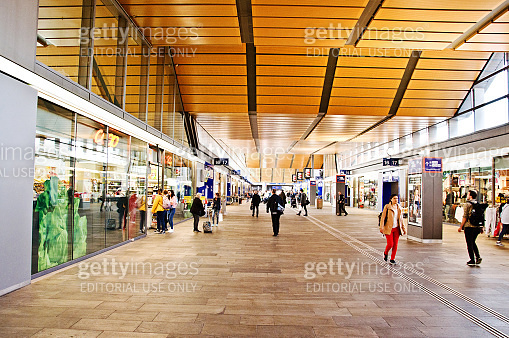 Passengers and tourists inside the colourful Bahnhof Basel SBB (Basel ...