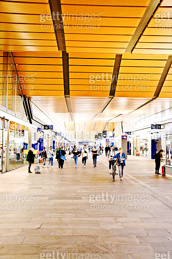 Passengers and tourists inside the colourful Bahnhof Basel SBB (Basel ...