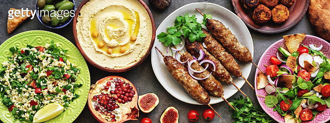 Assorted Middle Eastern and arabic dishes on a dark rustic background ...