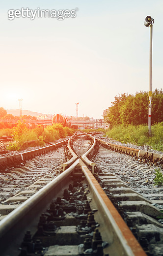 Two railways tracks merge close up.Vintage tone. Vertical photography ...