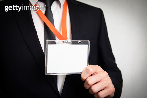 Businessman showing a white empty staff identity mockup with orange ...