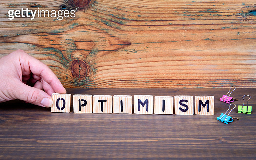 Optimism. Hope and confidence. Wooden letters on the office desk 이미지 ...