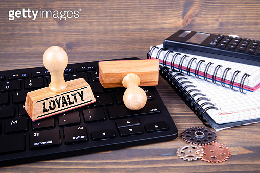 Loyalty concept. Computer keyboard and wooden stamps 이미지 (1145032167 ...