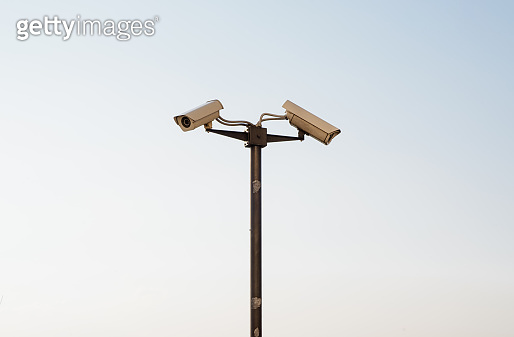 Cameras watching people, city. The concept of surveillance of people ...