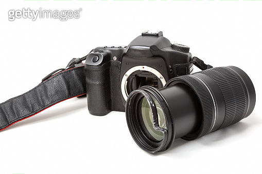 Broken digital SLR camera, dented protective filter on the zoom lens ...
