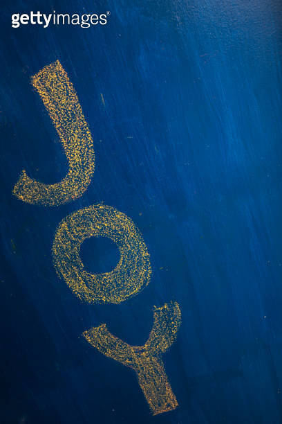 Handwriting word Joy on blue background 이미지 (1188185573) - 게티이미지뱅크