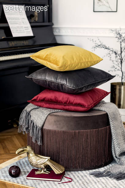 Stylish and luxury interior design of living room with brown velur pouf ...