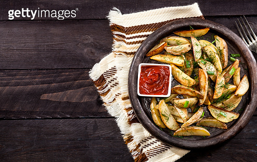 Homemade organic vegetable vegan vegetarian baked potato wedges with ...