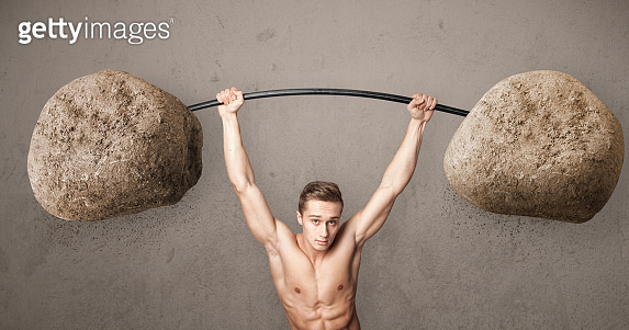 muscular man lifting large rock stone weights 이미지 (1170884896) - 게티이미지뱅크