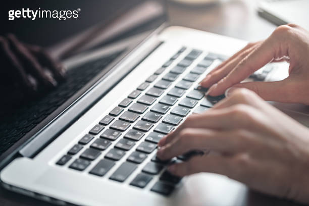 Getting down to work. Woman working on a laptop. 이미지 (1162332609) - 게티이미지뱅크