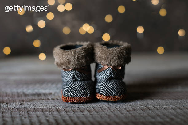 Holiday Christmas Baby Toy Small Boots on Wooden Table Background. Cozy ...