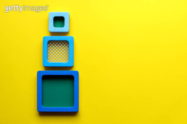 Geometry. Three blue squares on bright yellow background. Minimalism ...