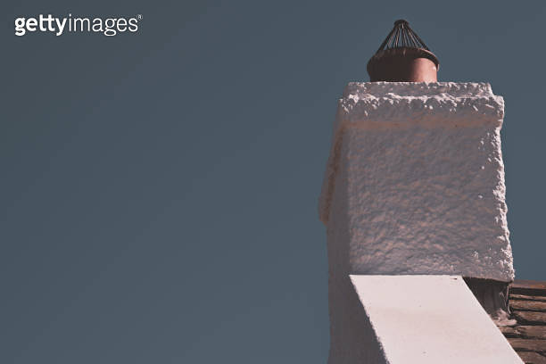 Chimney stack, gable wall and slate roof of a typical traditional Irish ...