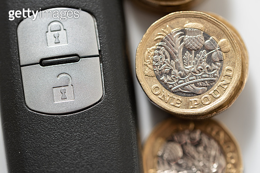 Modern car's remote key by stack of UK pound coins 이미지 (1179995009 ...
