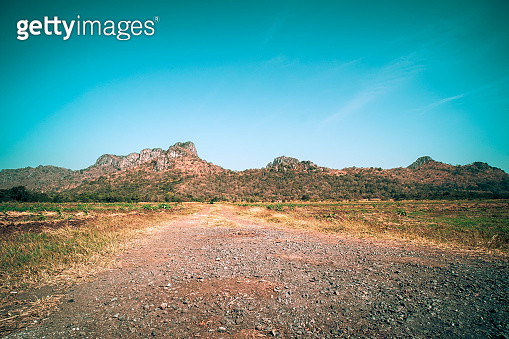 Country road in the mountains . A wide empty road in the desert toward ...