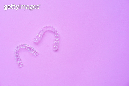close up top view of dental aligner retainer (invisalign) on soft ...