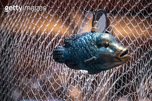 Christmas tree decoration in shape of big blue fish decorated by shiny ...