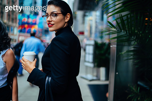 Half length portrait of confident female financial manager turning ...