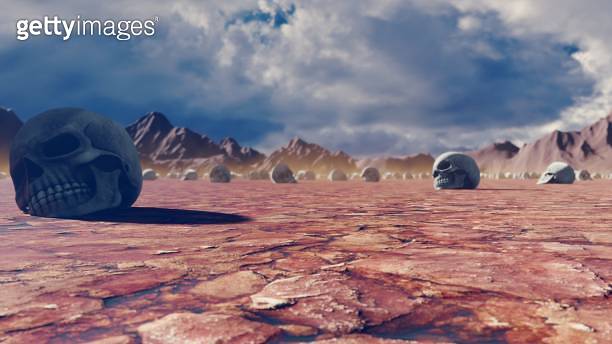 Mystical apocalyptic view, hot sultry desert and skulls on the cracked ...