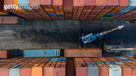 Container loading in cargo container in shipping yard with Forklift ...