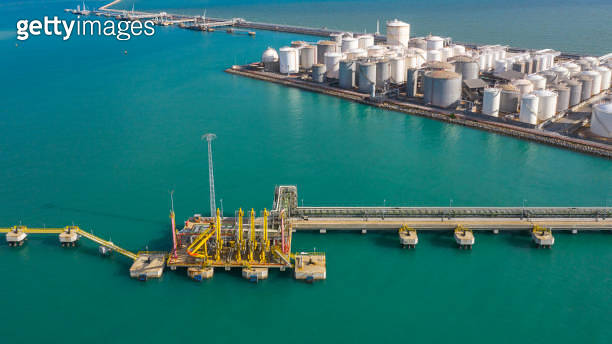 Aerial view loading arm oil and gas refinery at commercial port, Tank ...