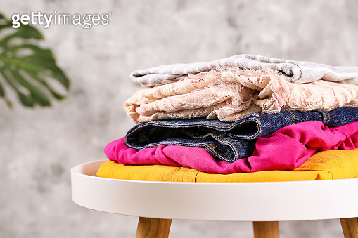 Bunch of different colorful clothing items folded in stack. 이미지 ...